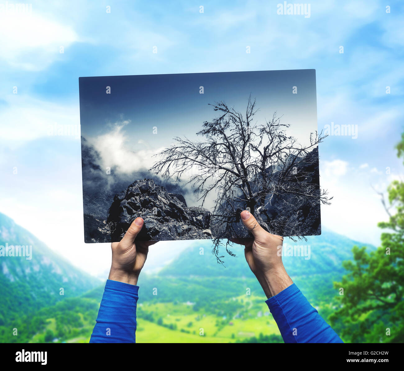 Male hands with dry, neglected nature landscape Stock Photo - Alamy