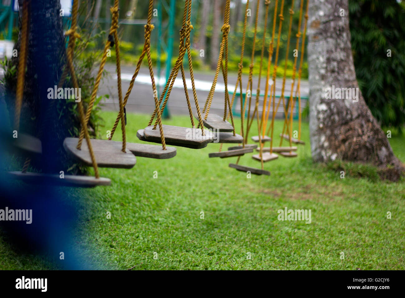 Wooden swings hi-res stock photography and images - Alamy