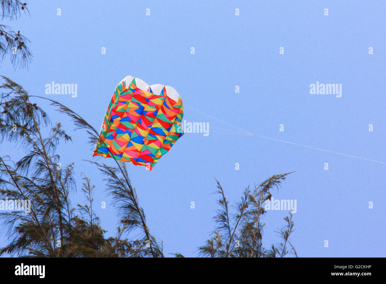 colorful kite in the blue sky at the summer holidays time Stock Photo ...