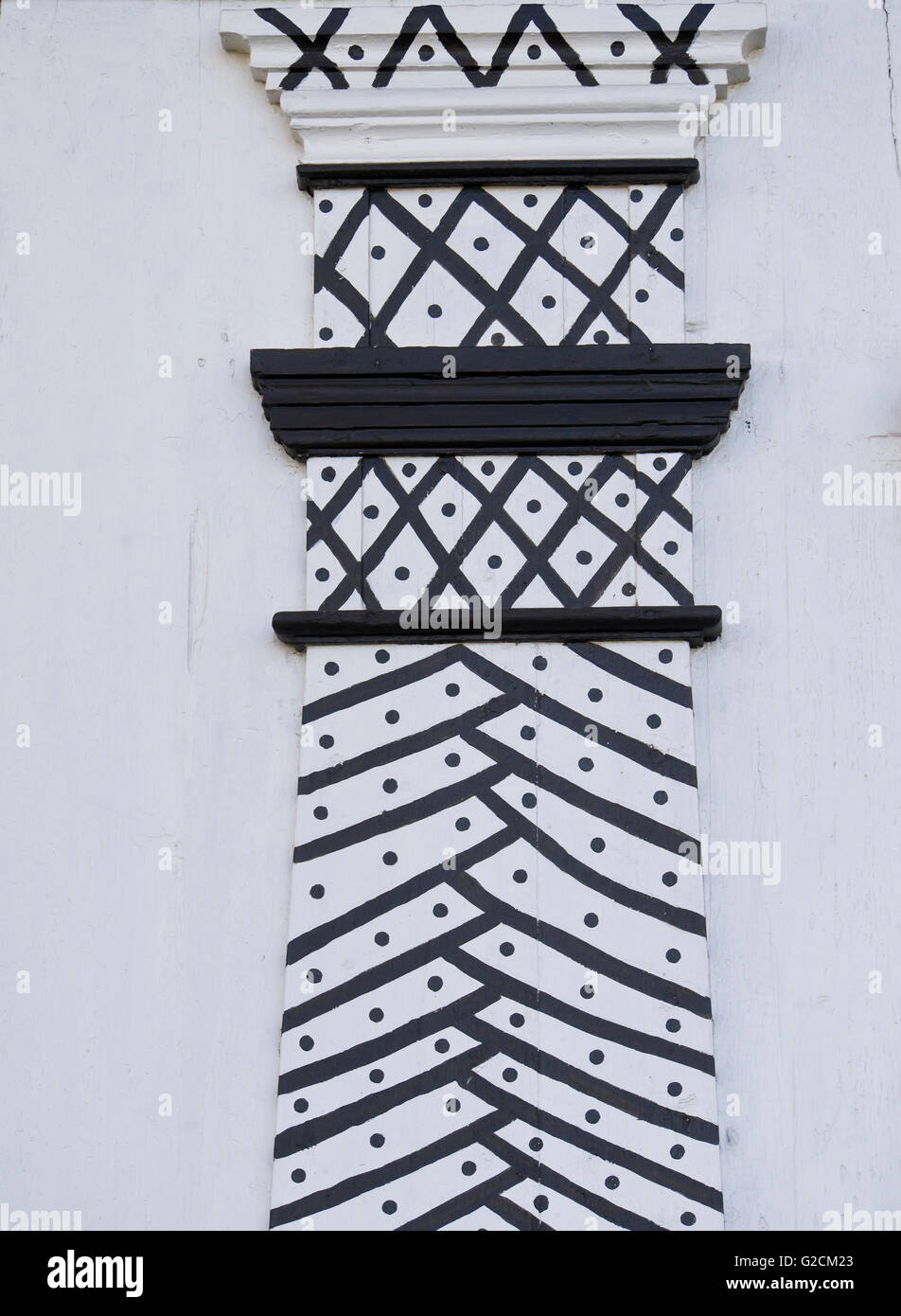Fake painted columns, baroque decoration on a stately wooden house from ...