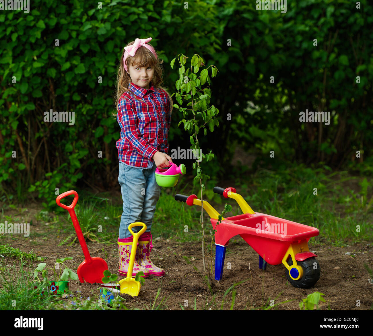 happy girl planting tree Stock Photo - Alamy