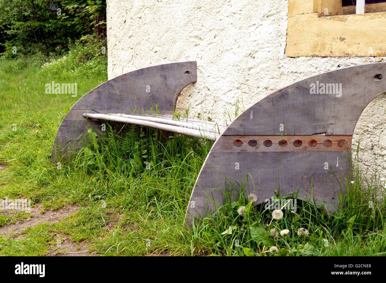 Bench in lamellas of brown wood in a wooden corner Stock Photo - Alamy