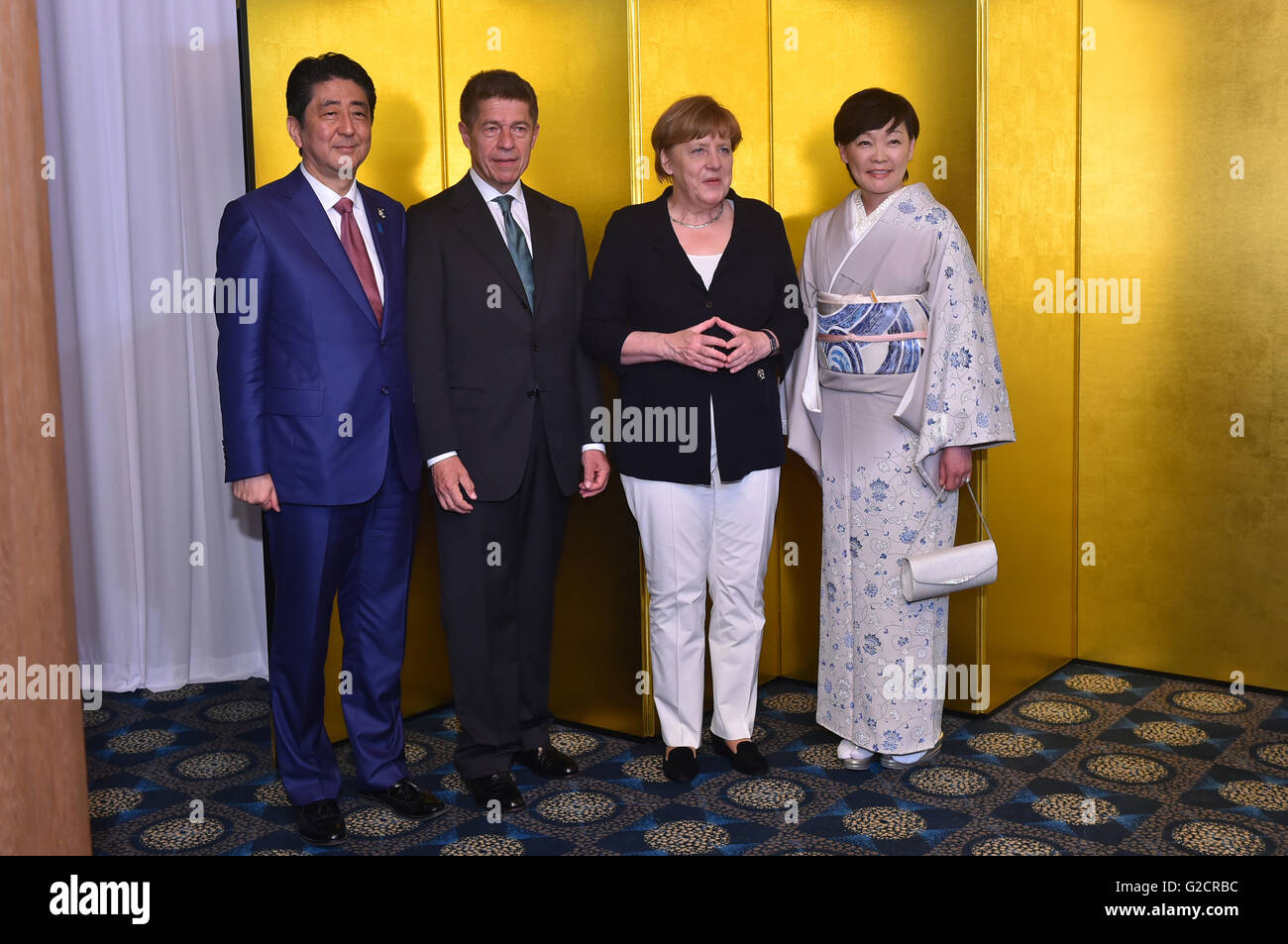 Japanese Prime Minister Shinzo Abe and his wife Akie Abe, stand with ...