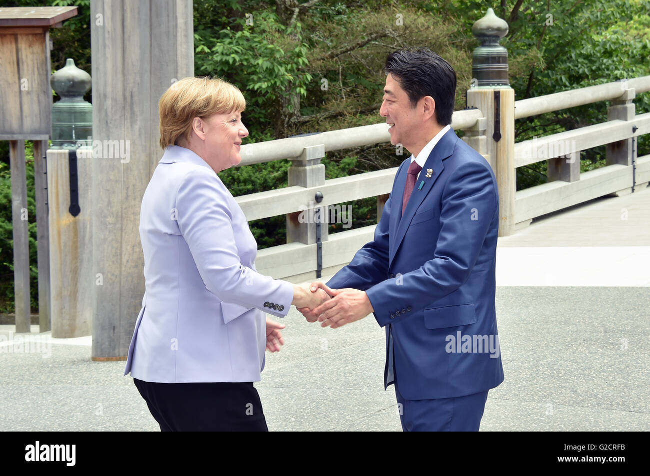 Japanese Prime Minister Shinzo Abe greets German Chancellor Angela ...