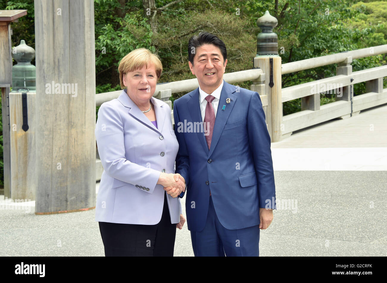 Japanese Prime Minister Shinzo Abe greets German Chancellor Angela ...