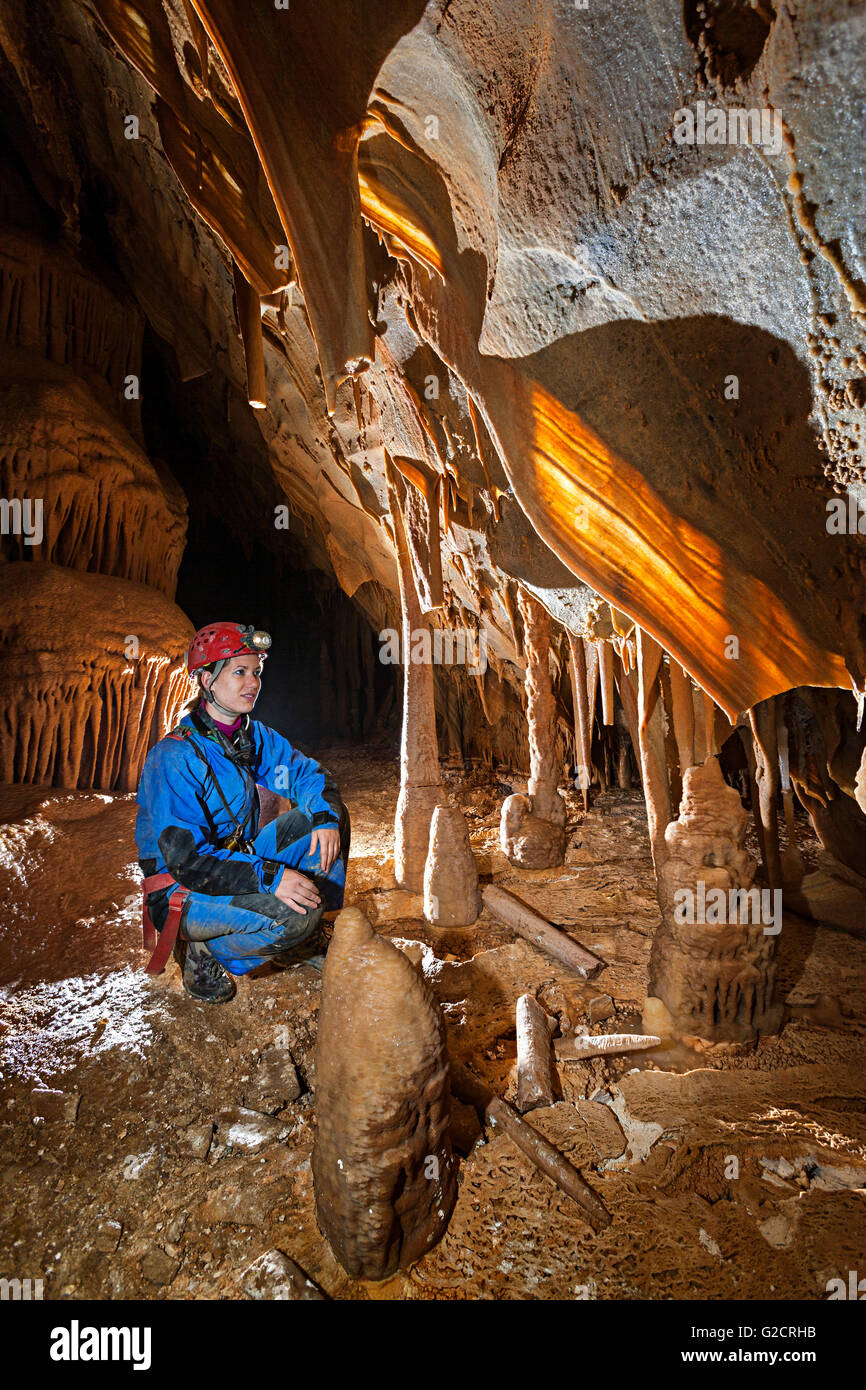 Female caver with formations in cave Grotta Impossibile, Italy Stock ...