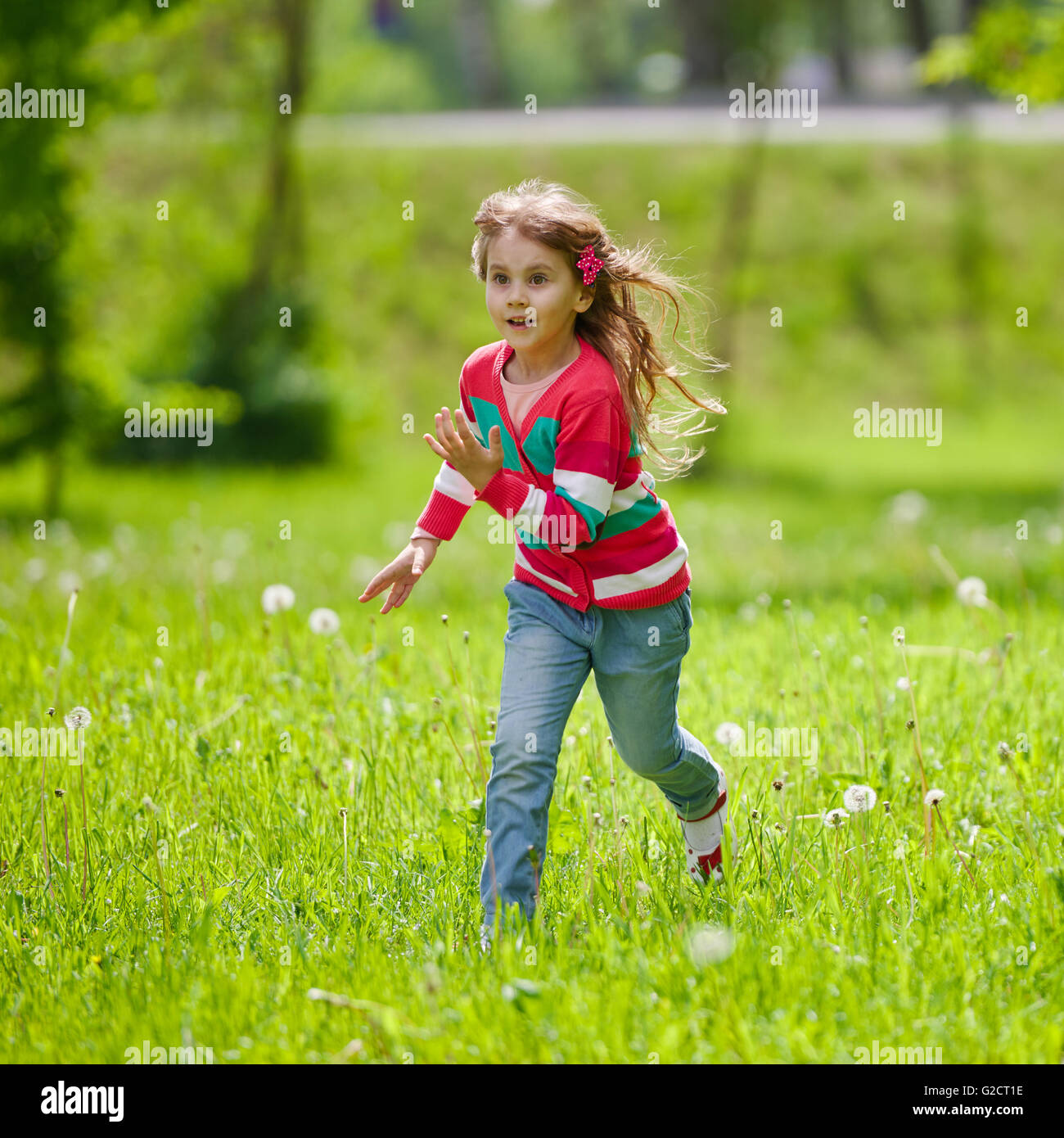 little happy running girl Stock Photo - Alamy