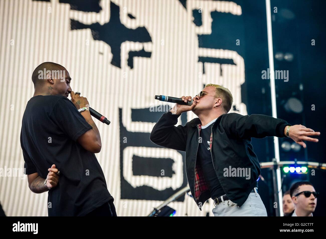 MC Rage (left) and Isaac Holman of Slaves (right) perform with Chase ...