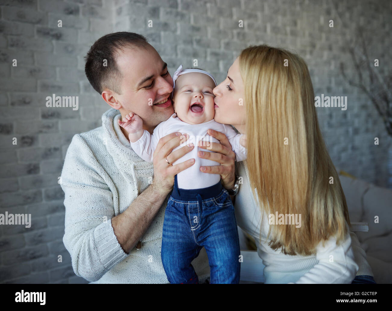 happy father and mother with baby Stock Photo - Alamy