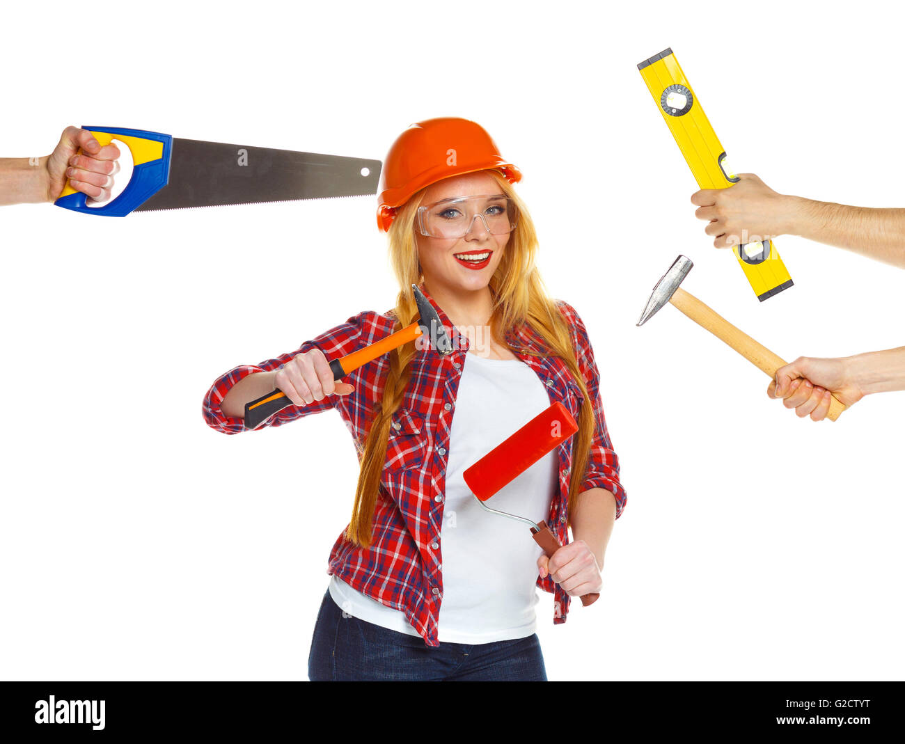 Cheerful girl builder and his hands around her with building tools in ...