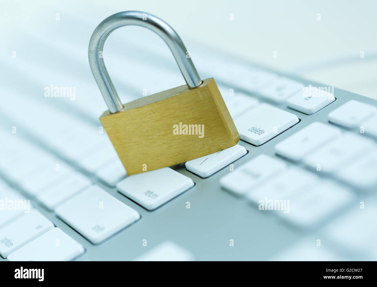 Security lock on white computer keyboard - computer security breach ...