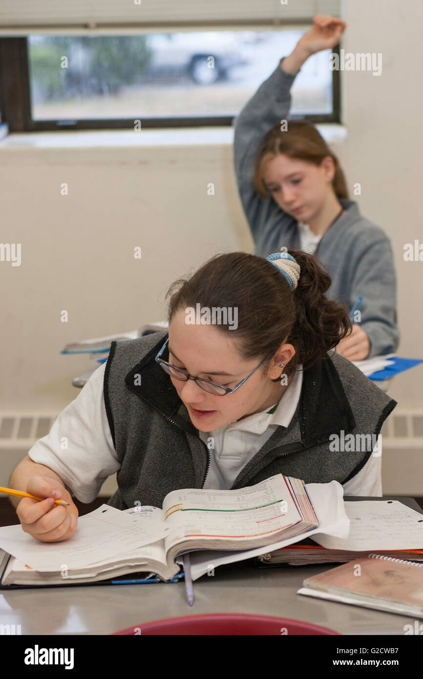Hands up in class teenagers hi-res stock photography and images - Alamy