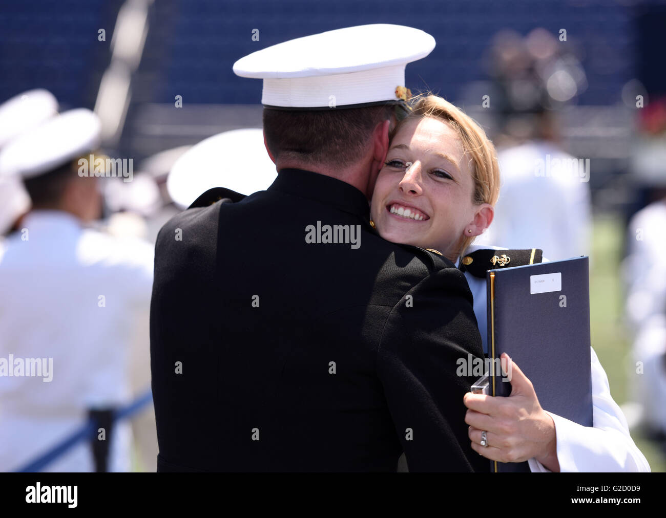 Annapolis, USA. 27th May, 2016. Graduates embrace each other during ...