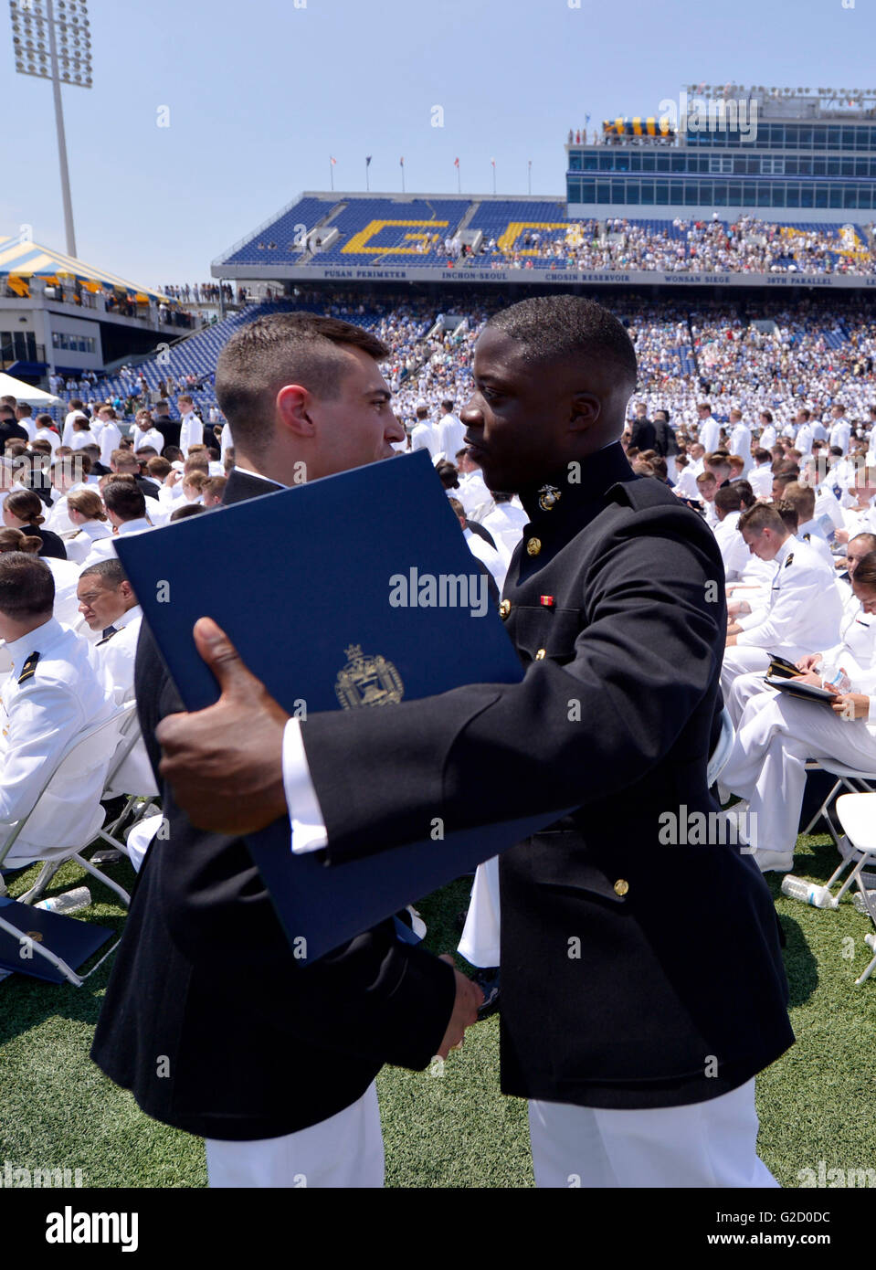 Annapolis, USA. 27th May, 2016. Graduates embrace each other during ...