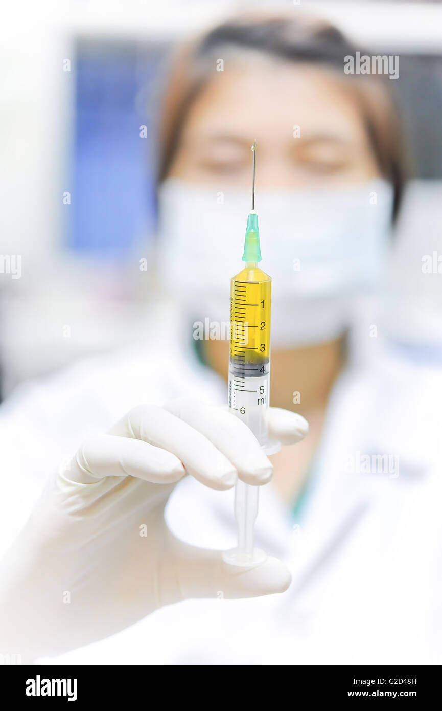 doctor using a syringe Stock Photo - Alamy