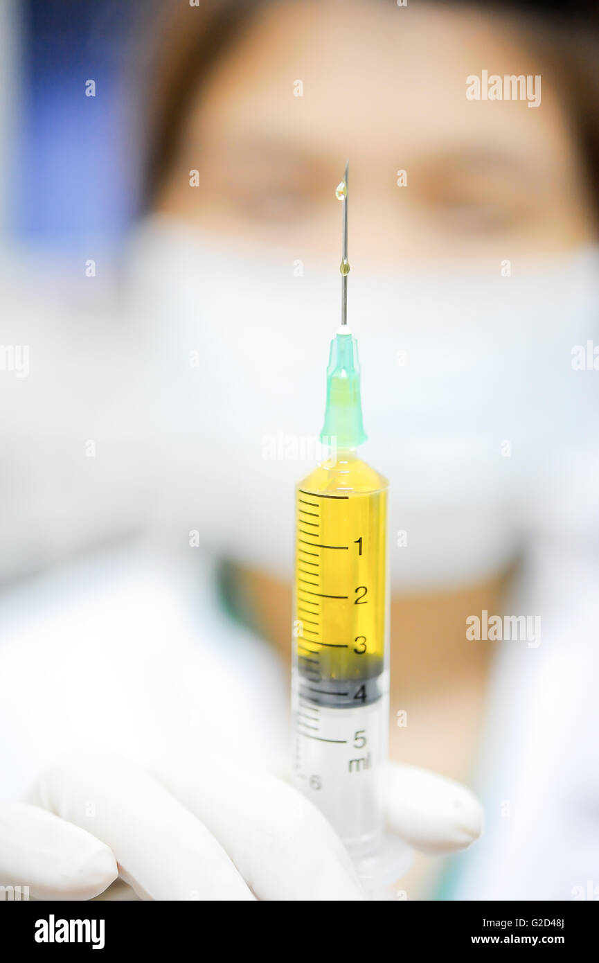 doctor using a syringe Stock Photo - Alamy