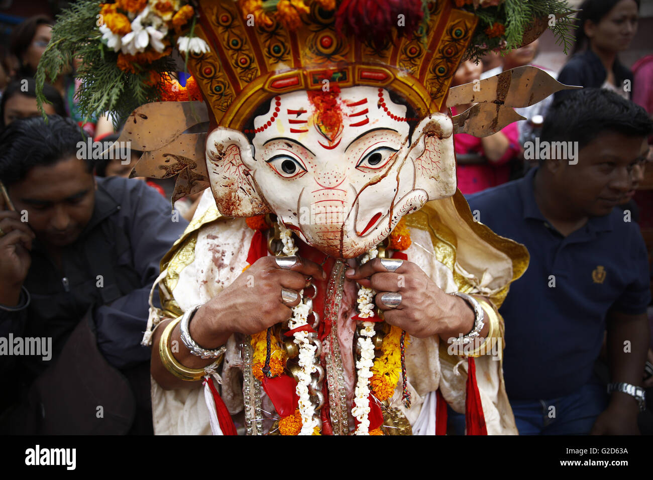 Kathmandu, Nepal. 28th May, 2016. A person dressed as deity gets ready ...