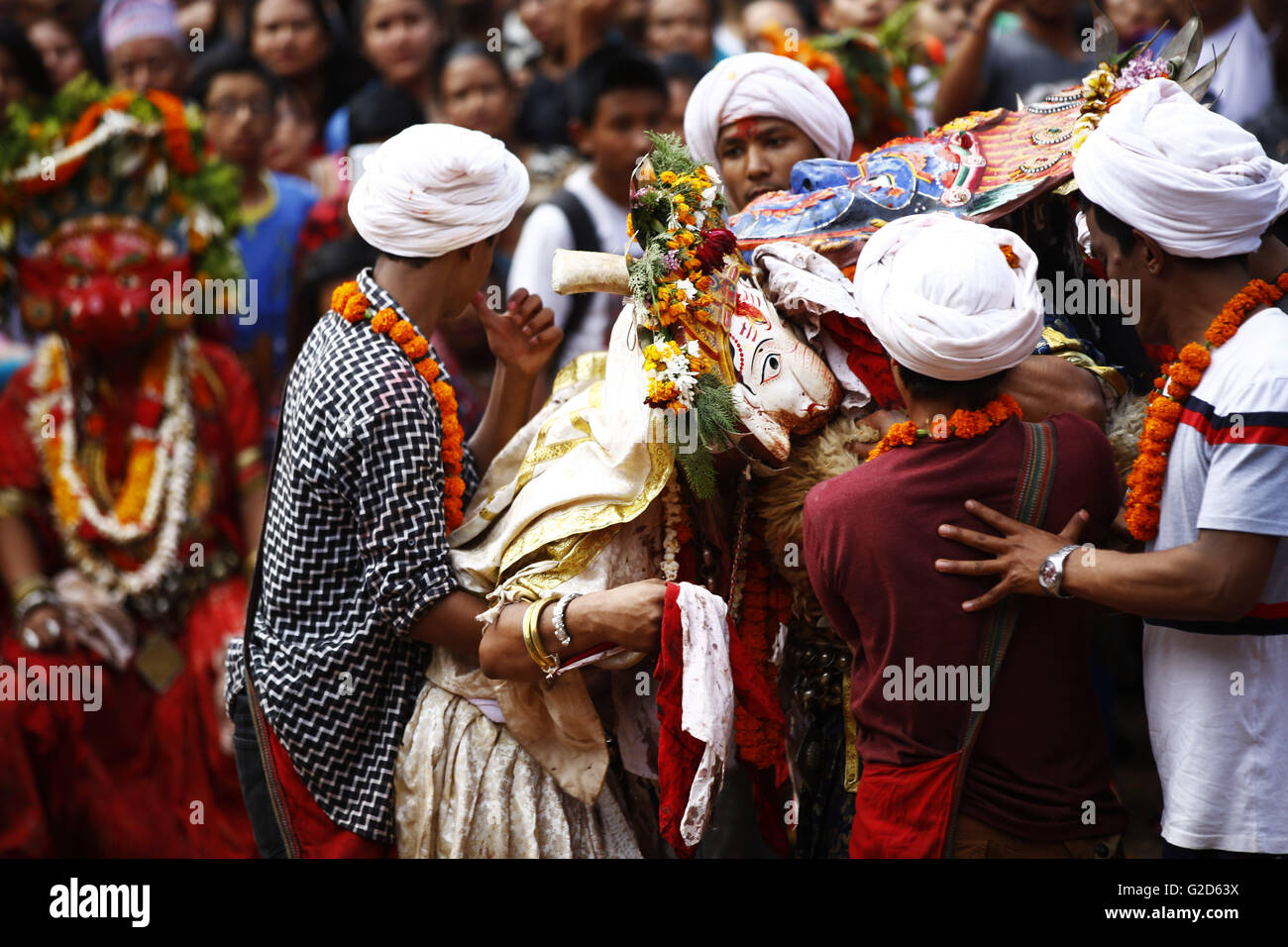 Kathmandu, Nepal. 28th May, 2016. People dressed as deities drink blood ...