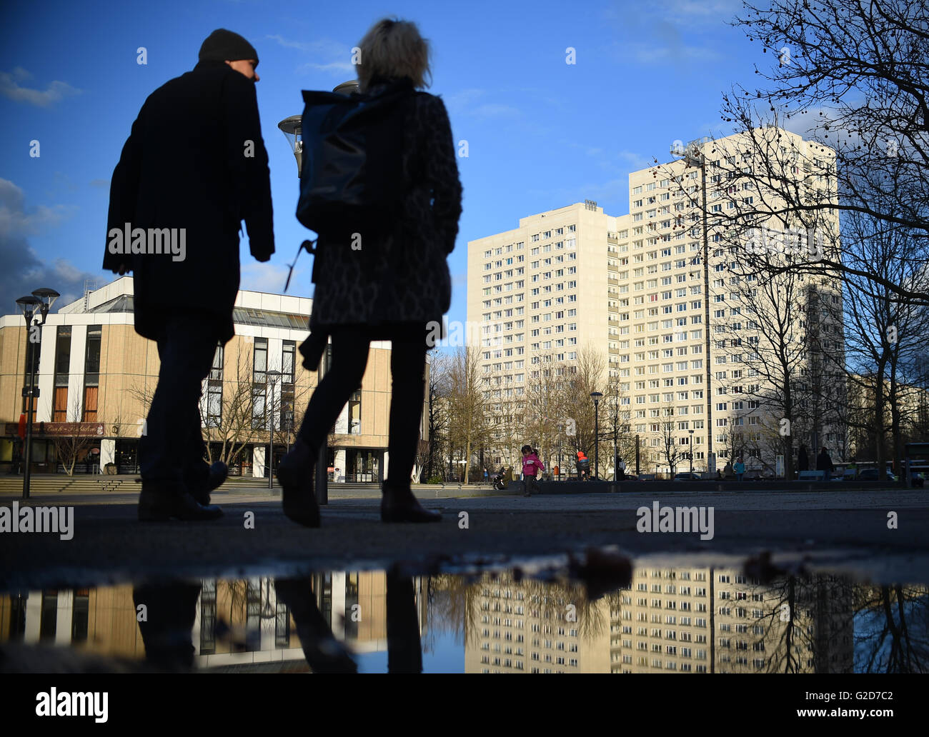 Typical East German high-rise residences 'Plattenbaus' are reflected in ...
