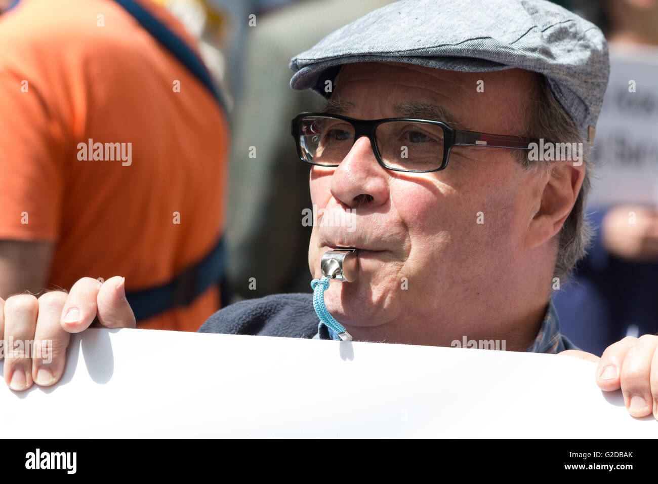Madrid, Spain. 28th May, 2016. A man whistling during a march in Madrid ...