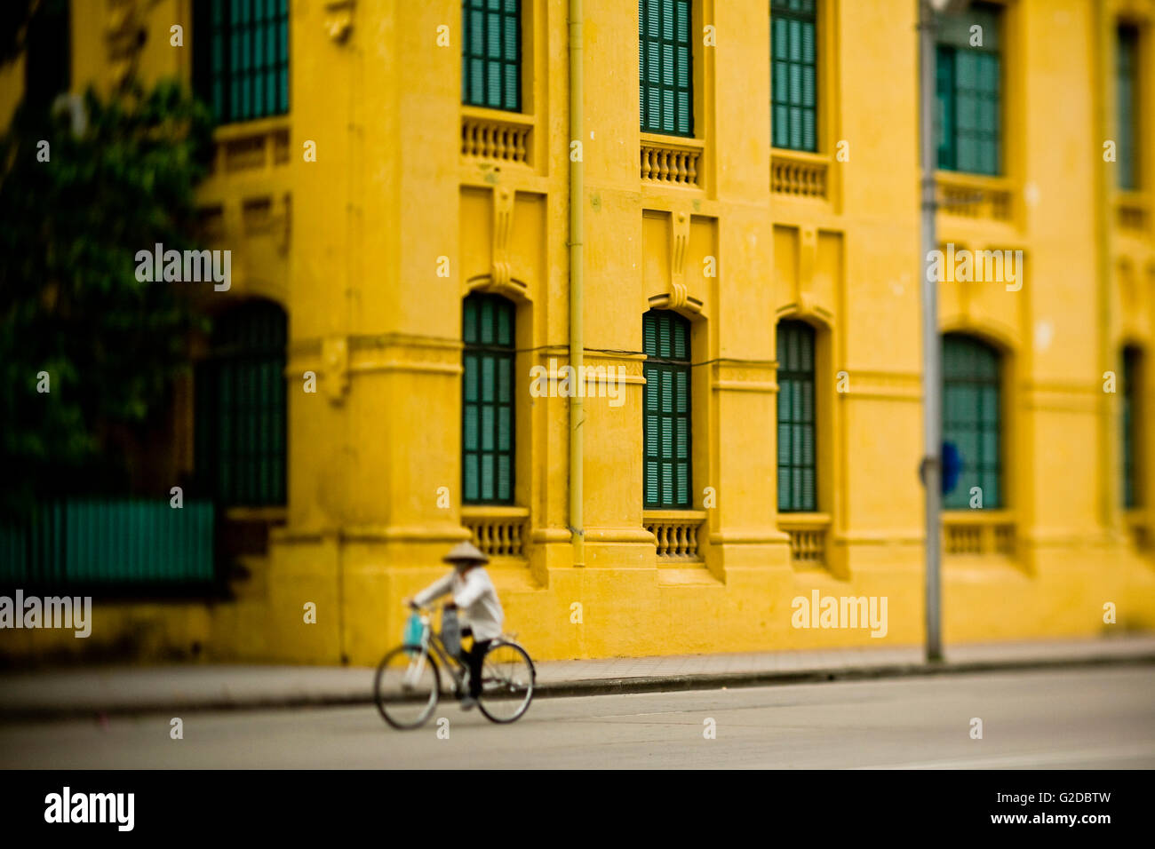 Bicyclist Passing Yellow Building, Ba Dinh Square, Hanoi, Vietnam Stock ...