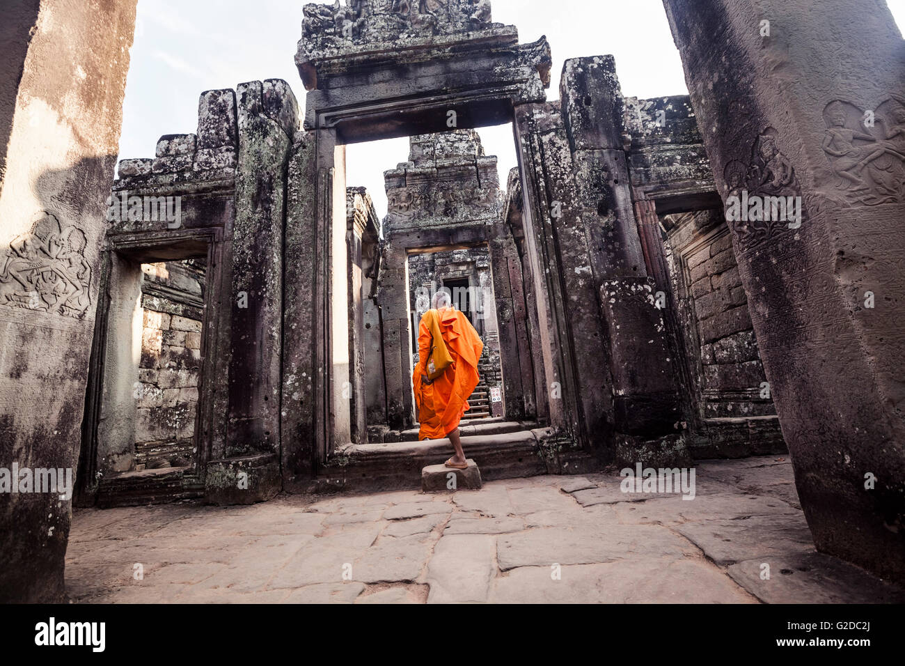 Monk Walking Through Temple, Angkor Wat, Cambodia Stock Photo - Alamy