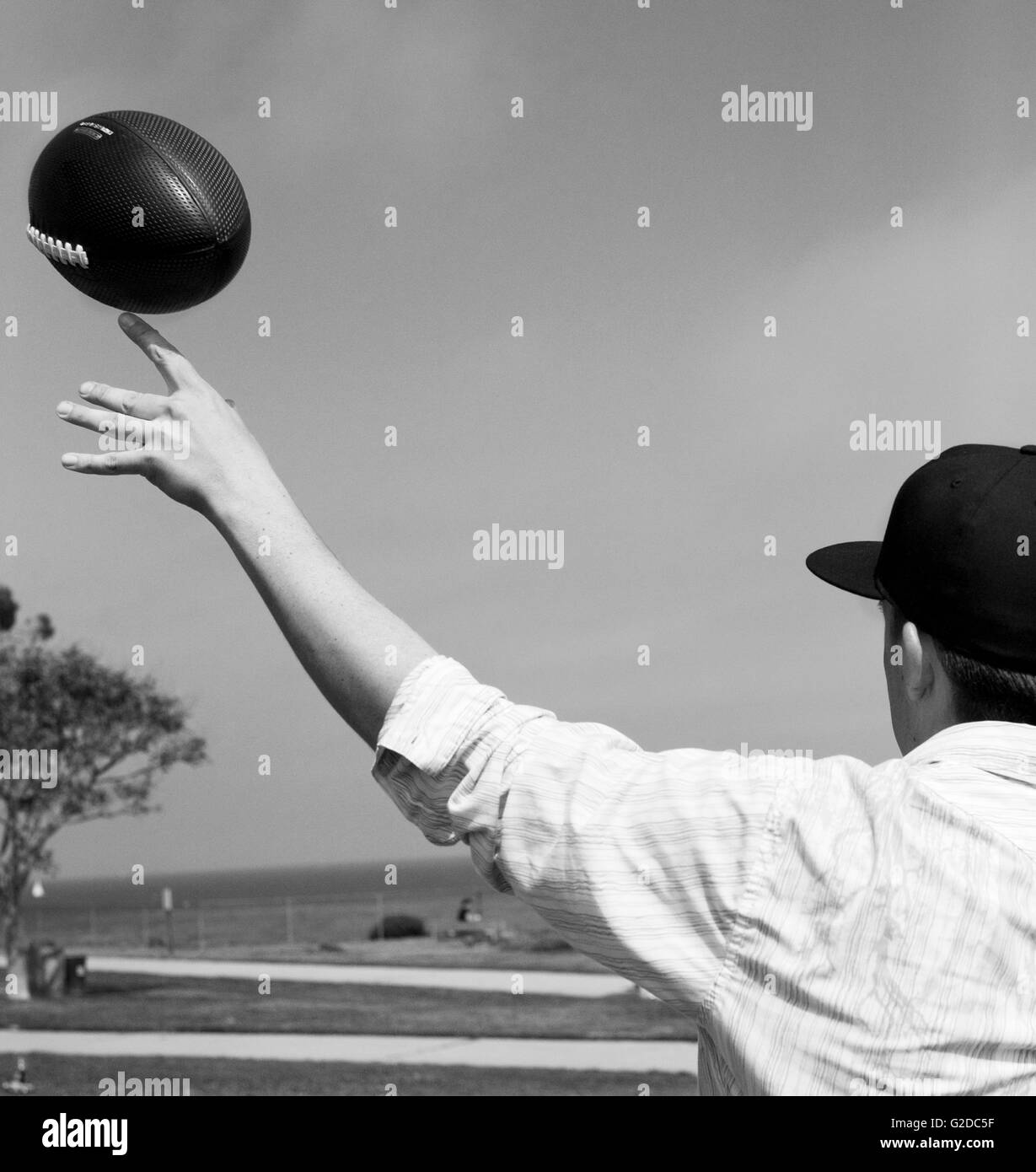 Man Throwing Football Stock Photo - Alamy