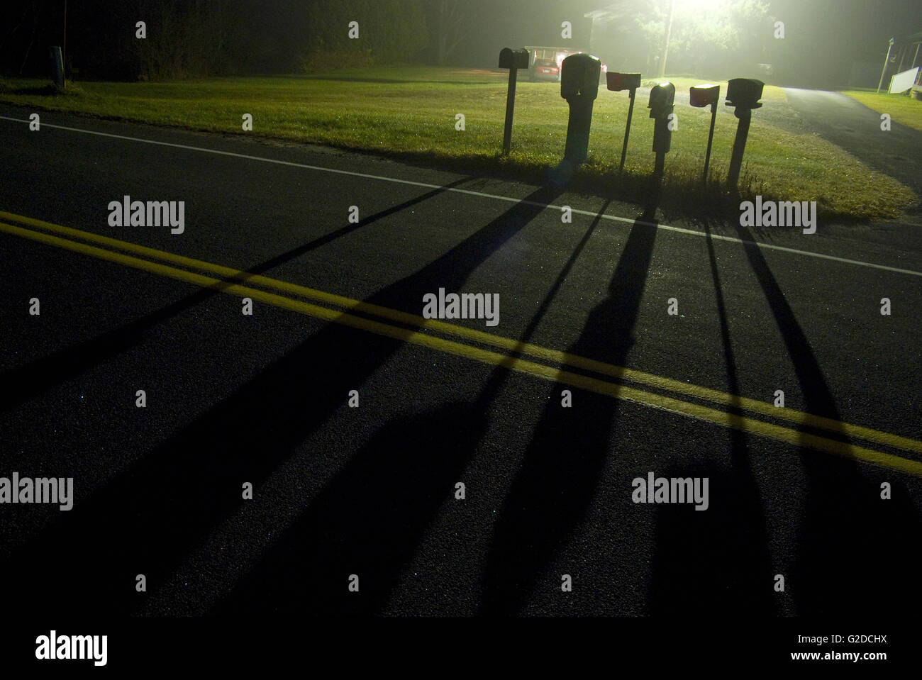 Mailboxes Casting Long Shadows Stock Photo - Alamy