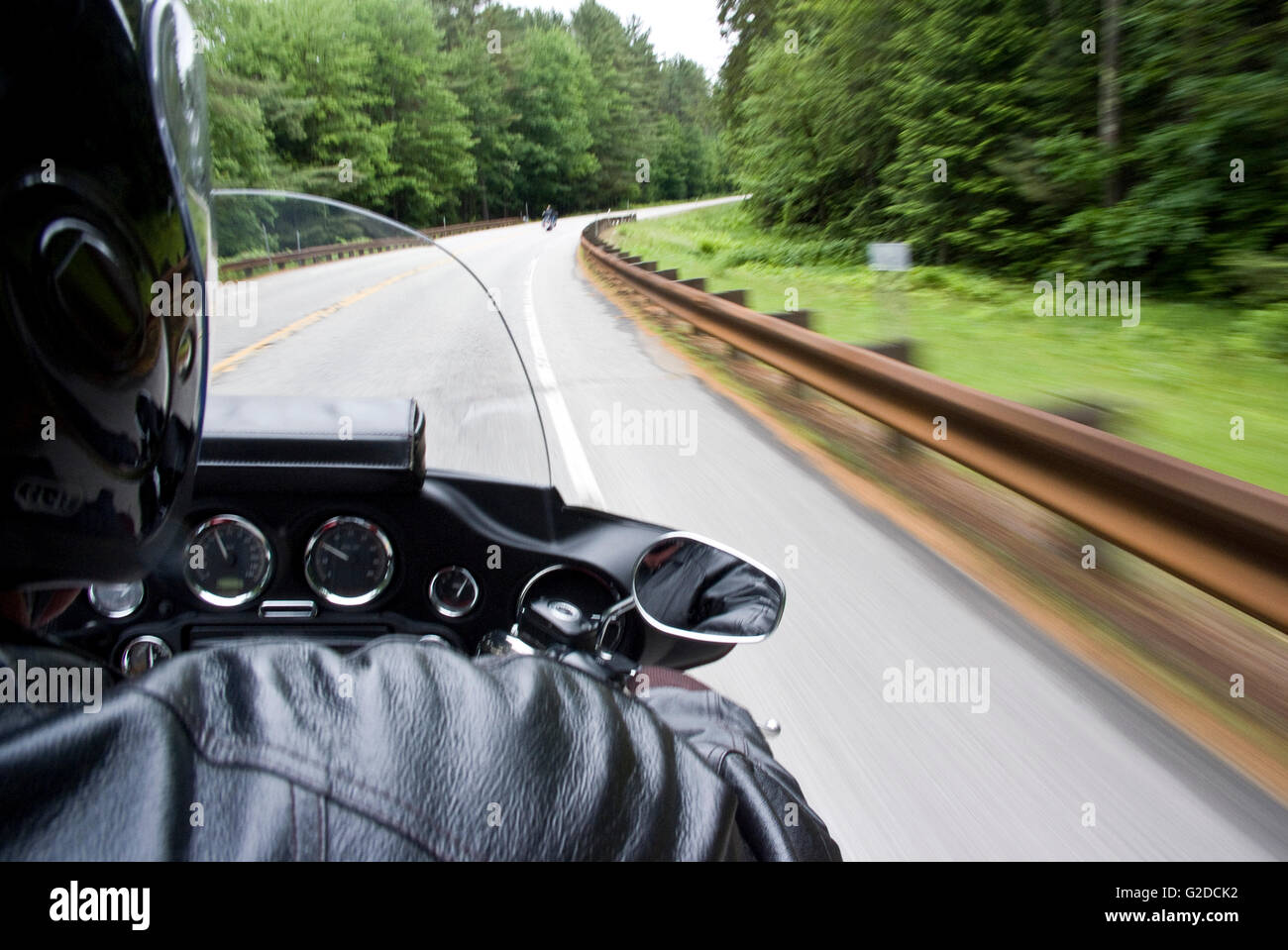 Motorcycle and Rider on Scenic Road Stock Photo - Alamy
