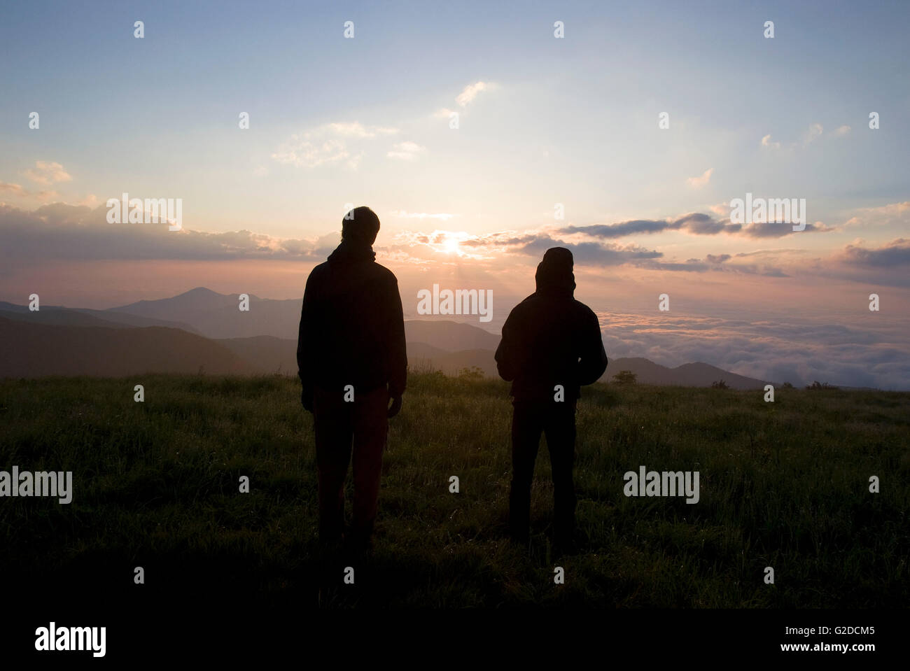 Two men watching sunrise hi-res stock photography and images - Alamy