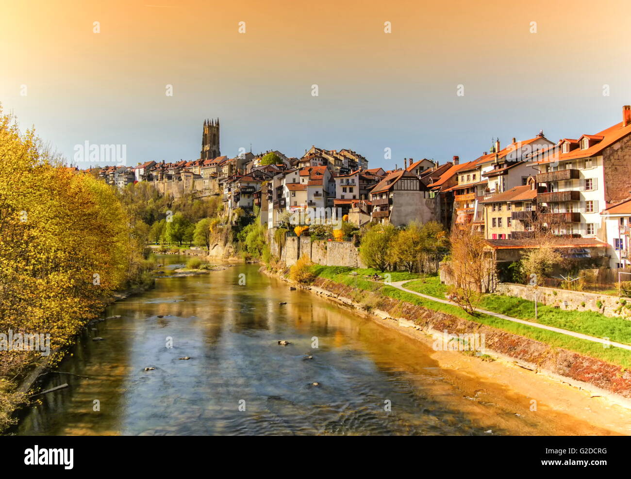 Panoramic view of cathedral of St. Nicholas and Sarine river in ...