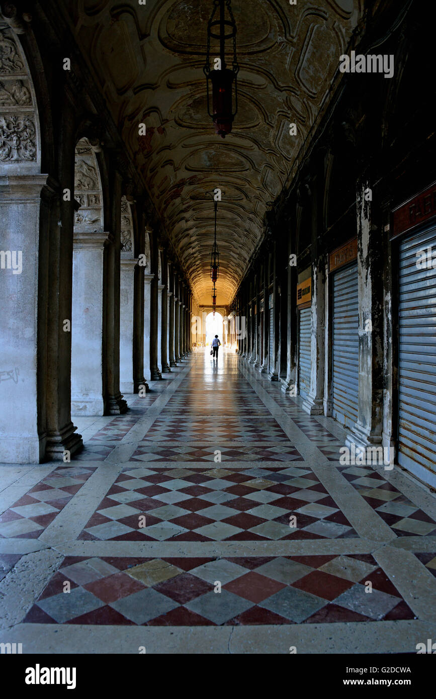 Woman Walking Down Ornate Stone Passageway, Rear View, San Marco Square ...