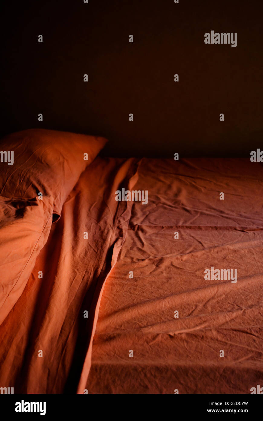 Bed with Red Sheets Stock Photo - Alamy