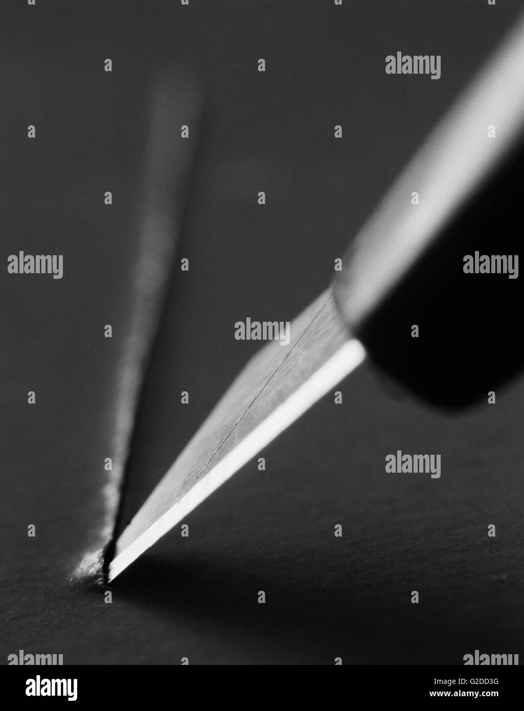 Cut paper knife Black and White Stock Photos & Images - Alamy