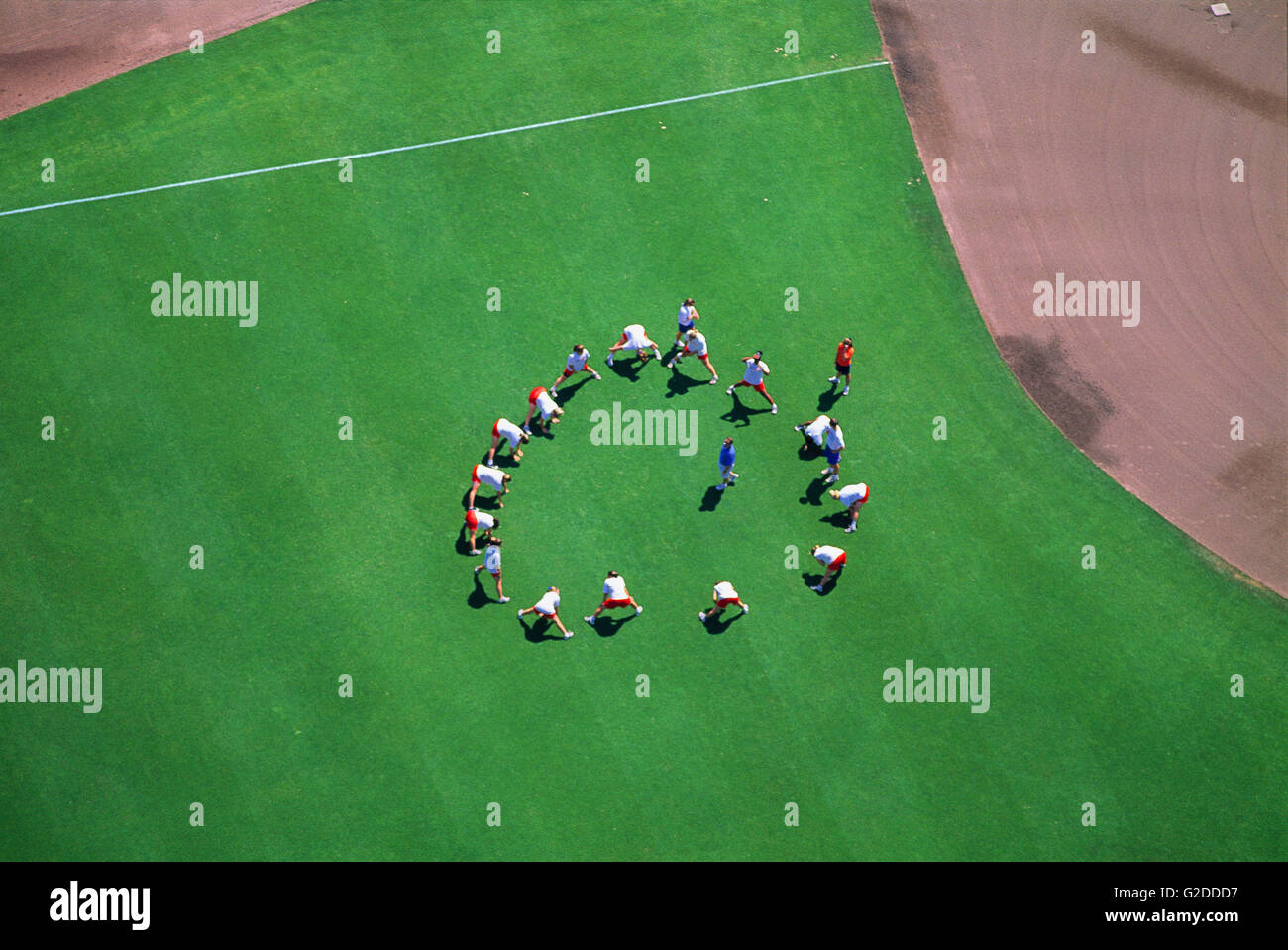 Team Stretching in Circle, High Angle View Stock Photo - Alamy