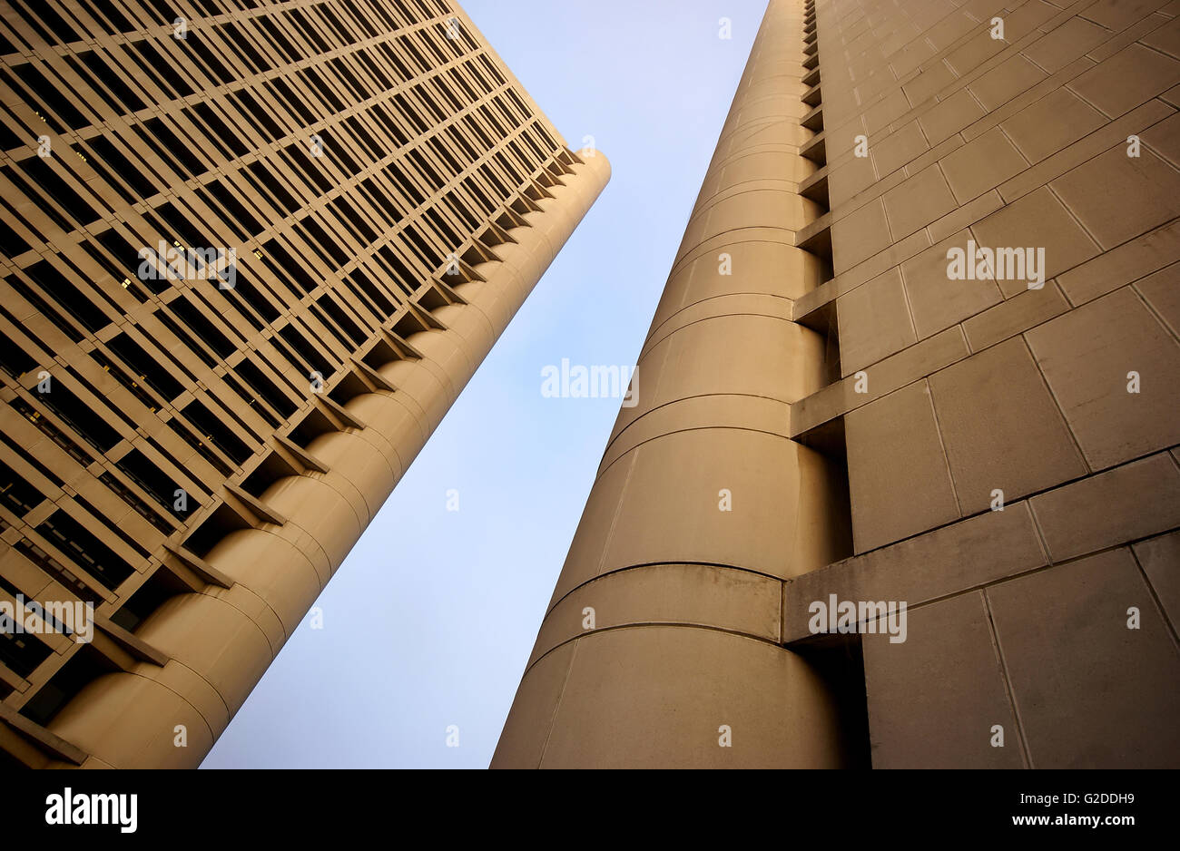 Asymmetric angle of modern high-rise concrete buildings at sun set ...