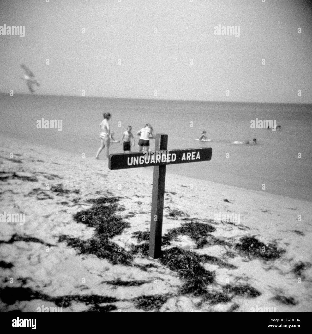 Unguarded beach sign hi-res stock photography and images - Alamy