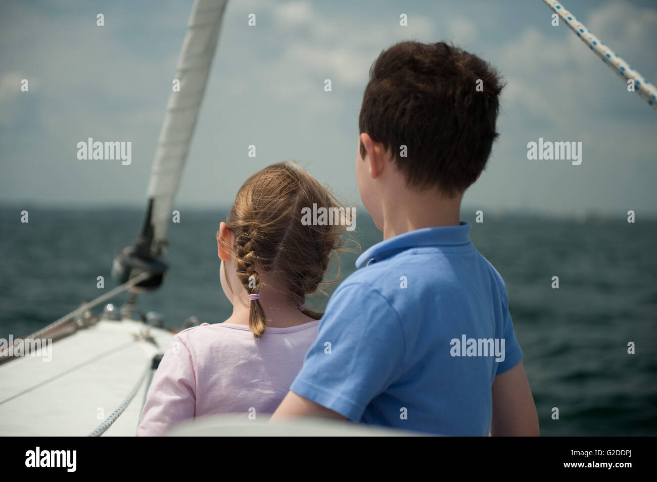 Girl and Boy on Sailboat, Rear View Stock Photo - Alamy