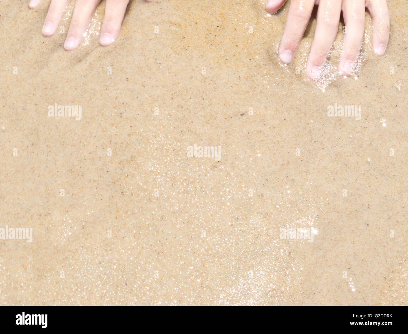 Sand hands beach High Resolution Stock Photography and Images - Alamy