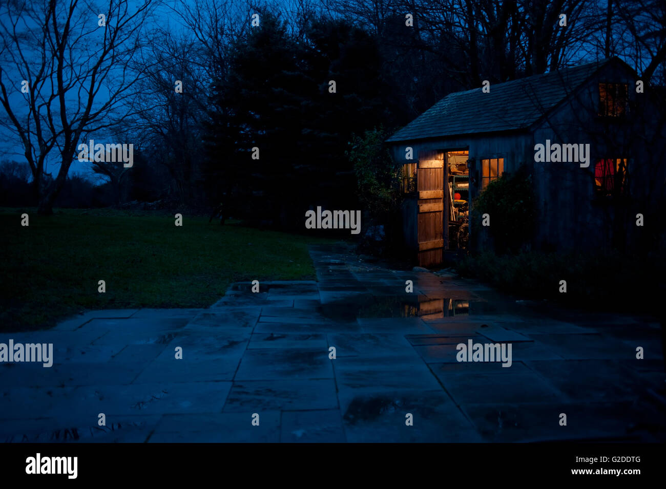 Shed with Light on at Night Stock Photo - Alamy