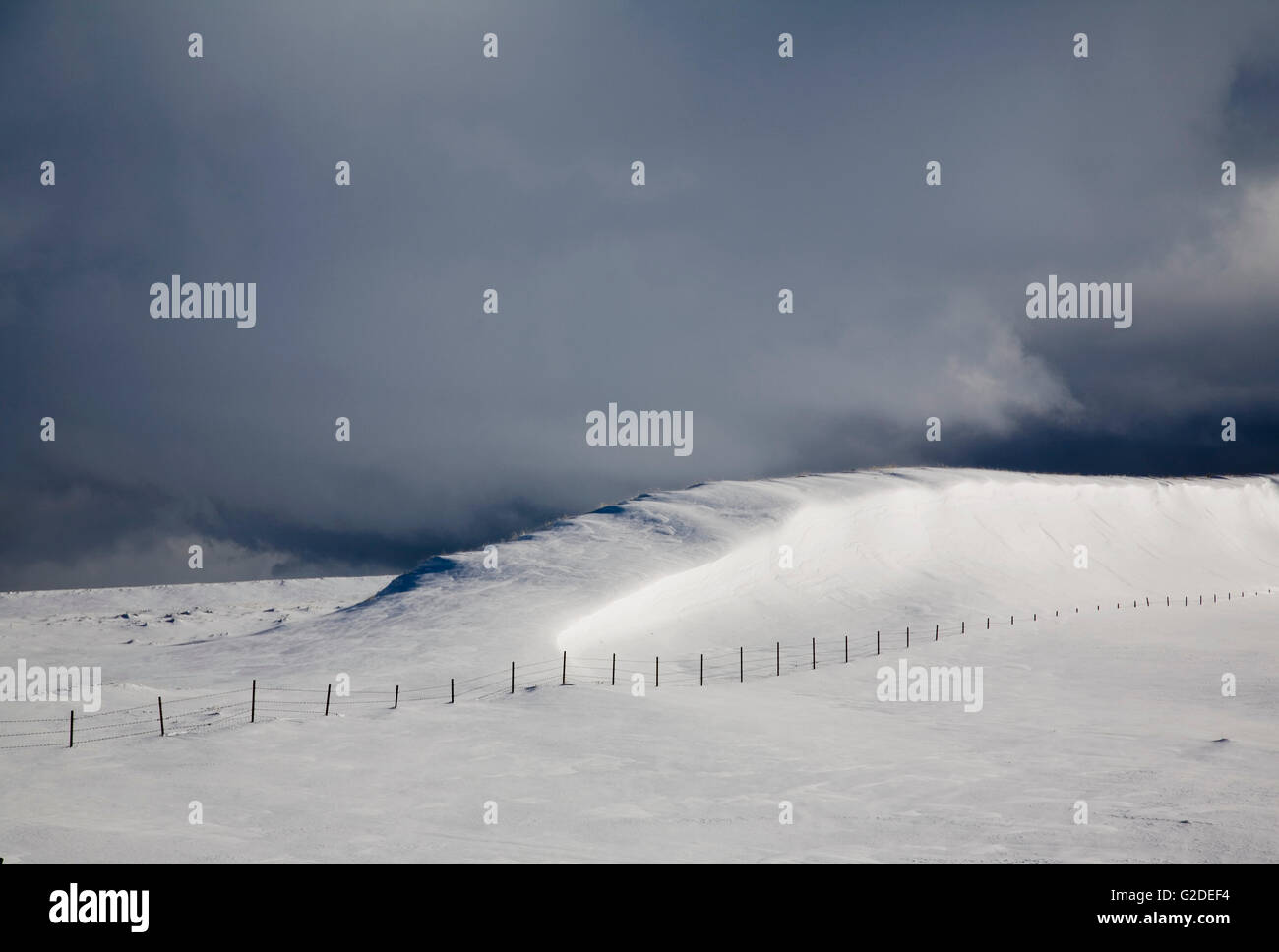 Large Snow Drift along Fence Stock Photo - Alamy