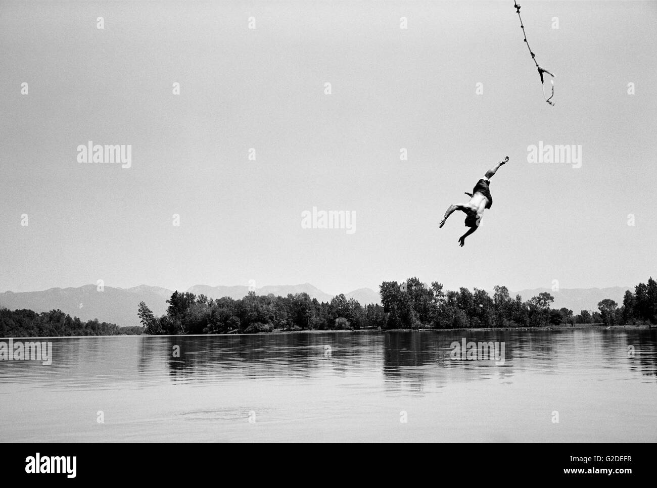 Swinging rope jumping river hi-res stock photography and images - Alamy