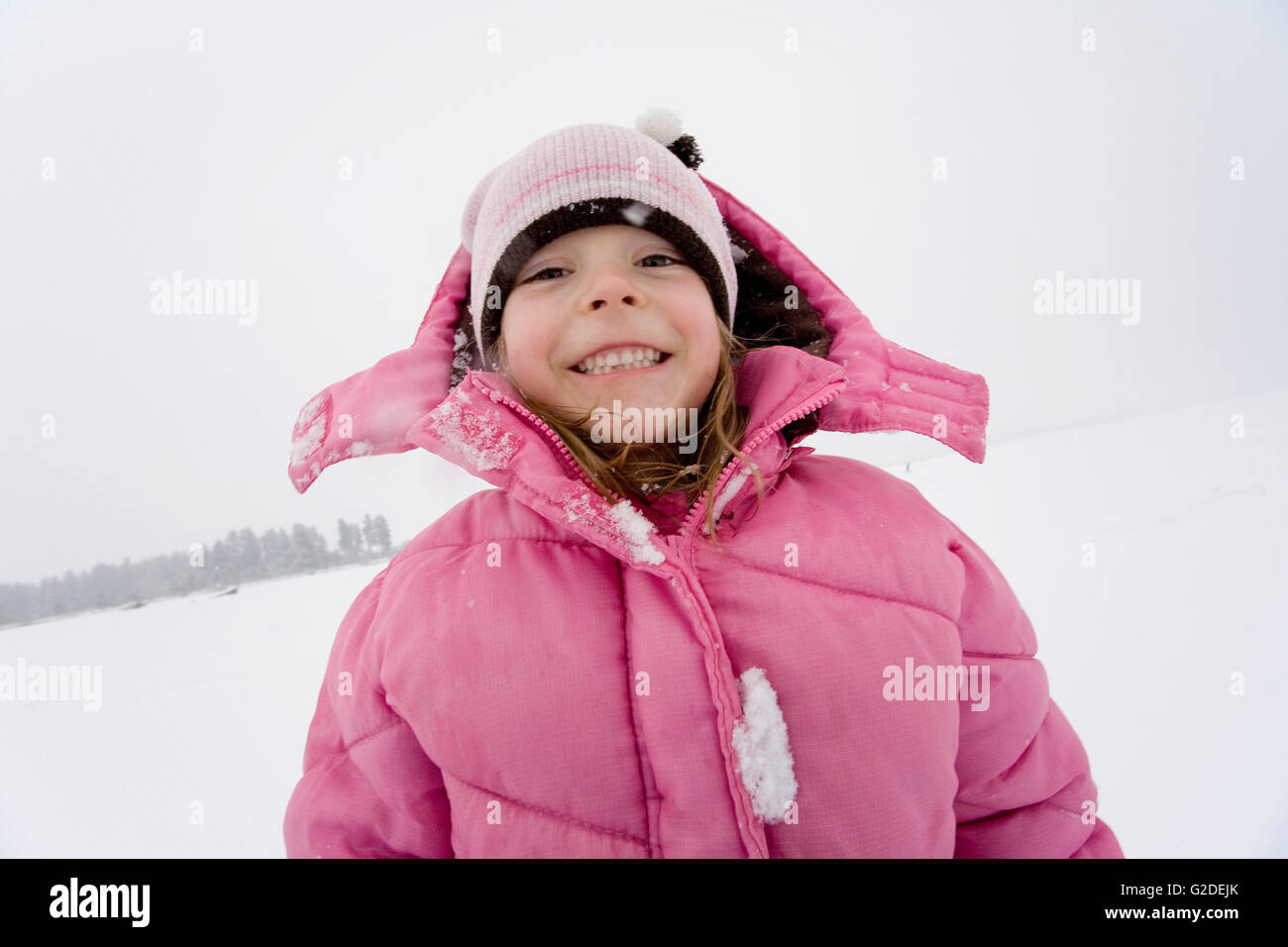 Smiling Young Girl in Pink Winter Coat Stock Photo - Alamy