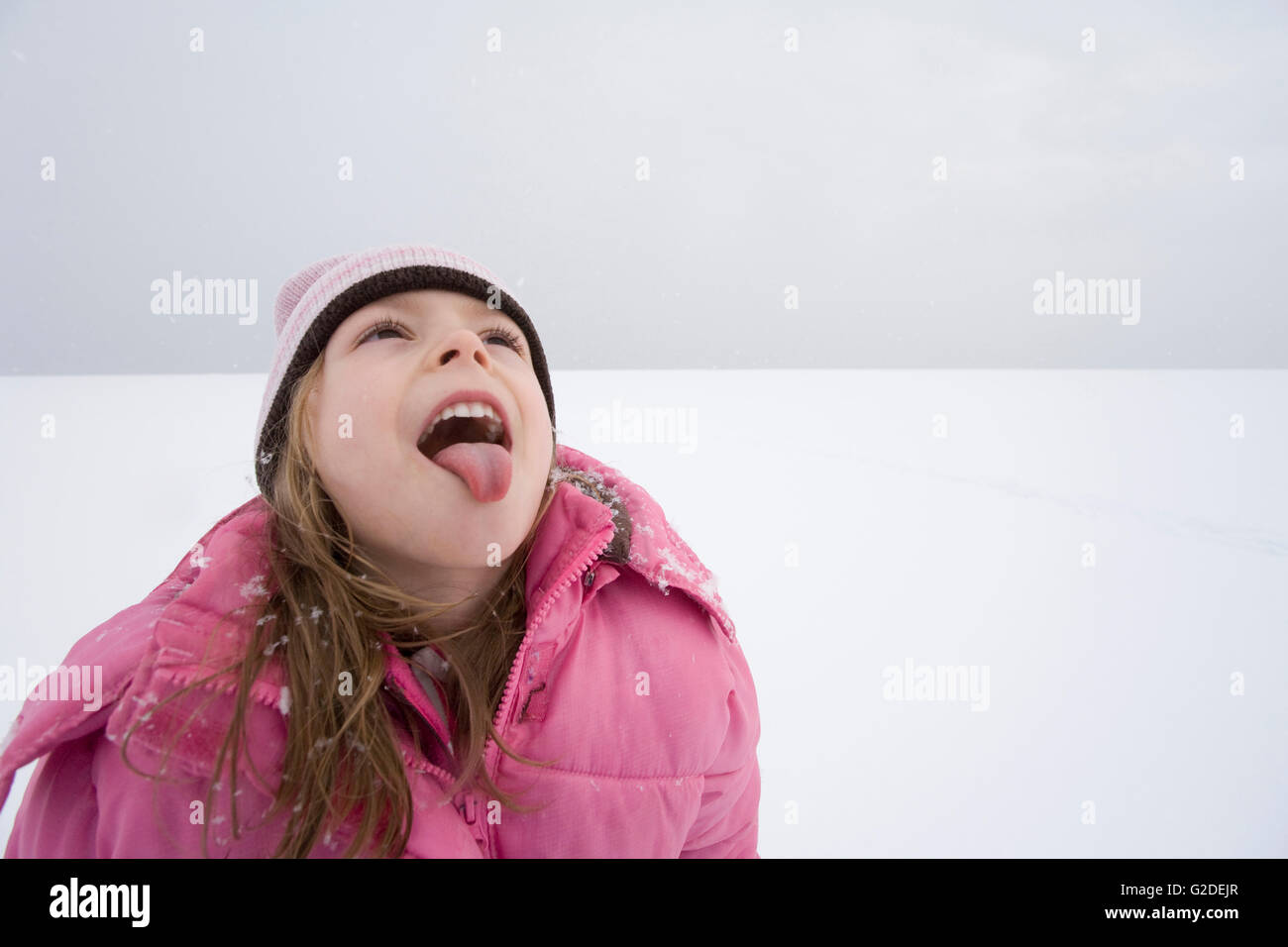 Girl catching snowflakes tongue hi-res stock photography and images - Alamy