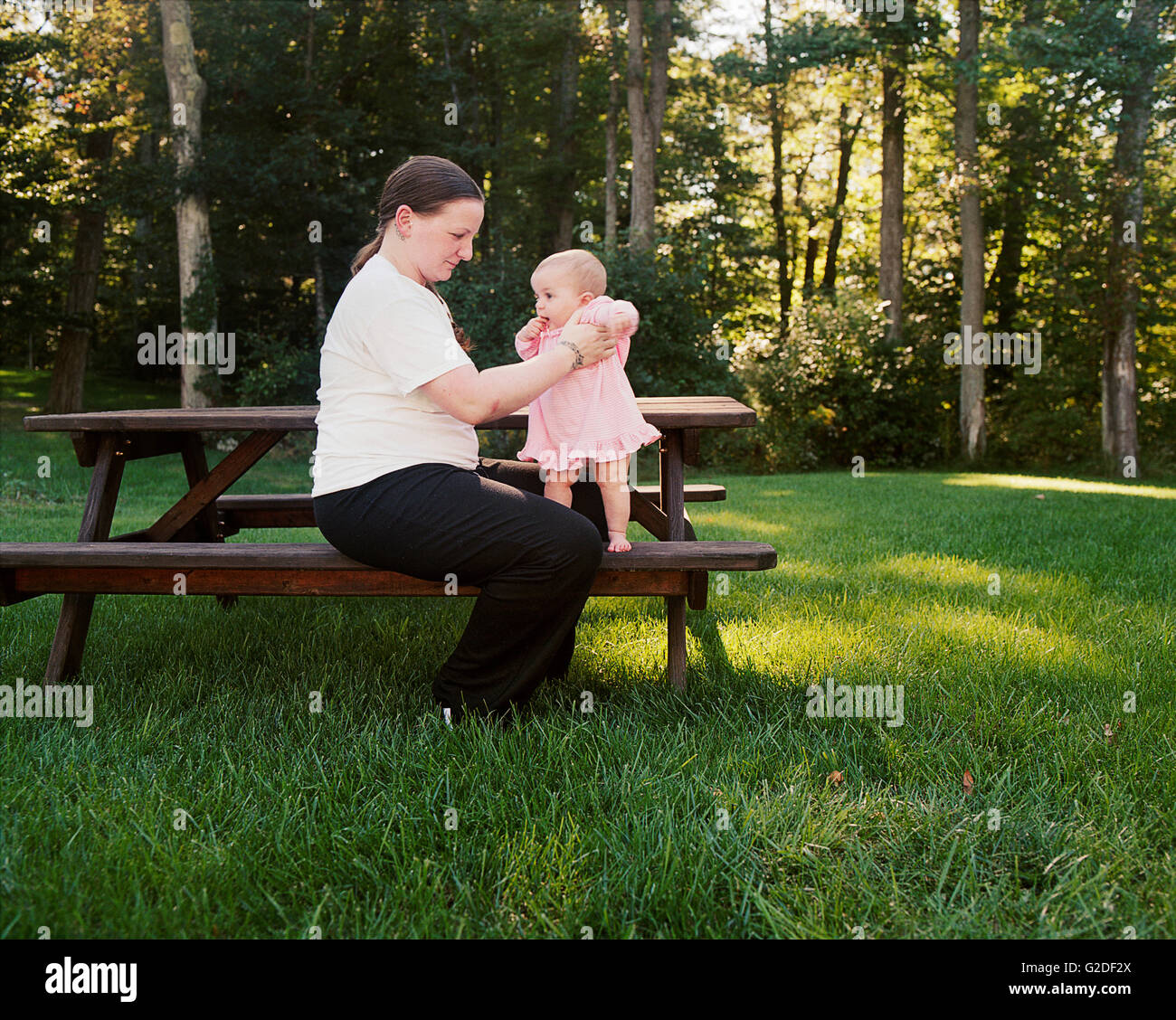 Girl Pink Dress Sitting On Bench High Resolution Stock Photography and ...