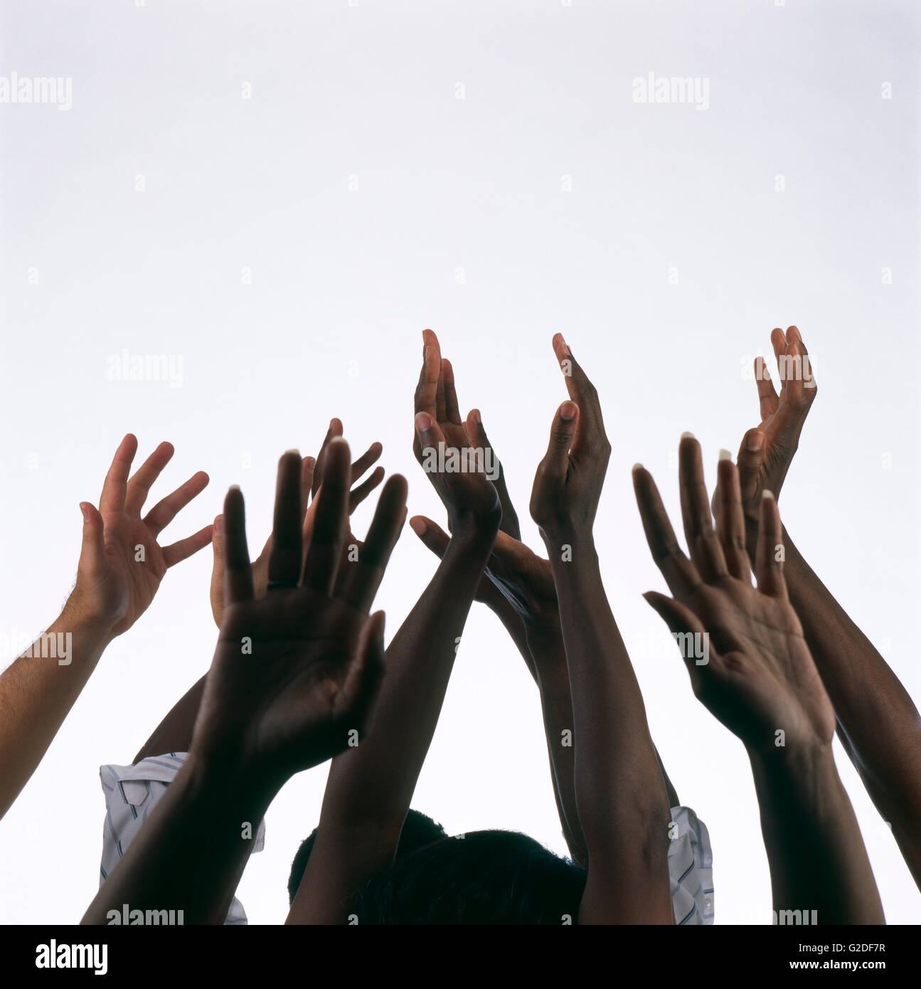 Group of People With Upraised Hands Stock Photo - Alamy
