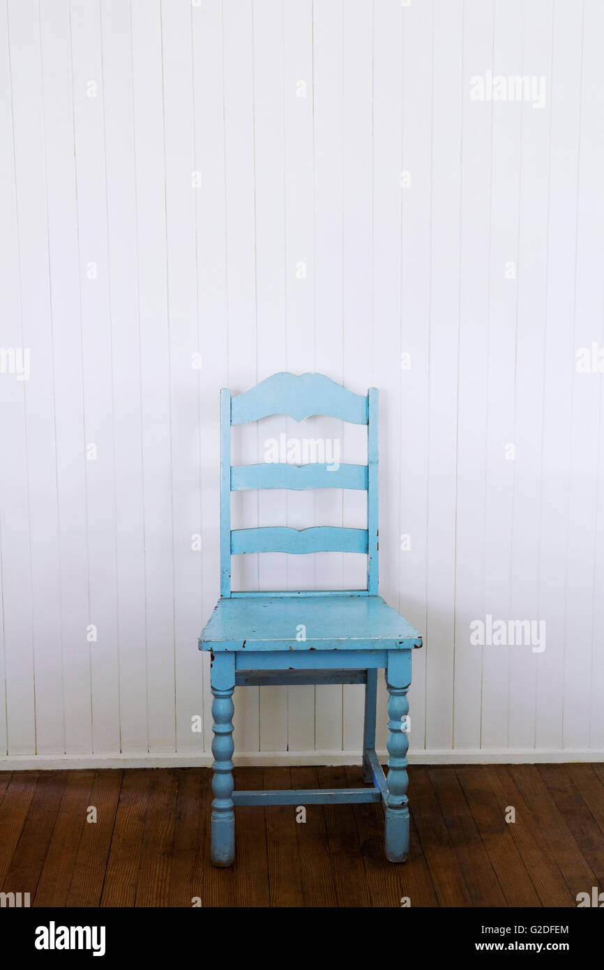 Old Blue Chair Against White Wall Stock Photo - Alamy