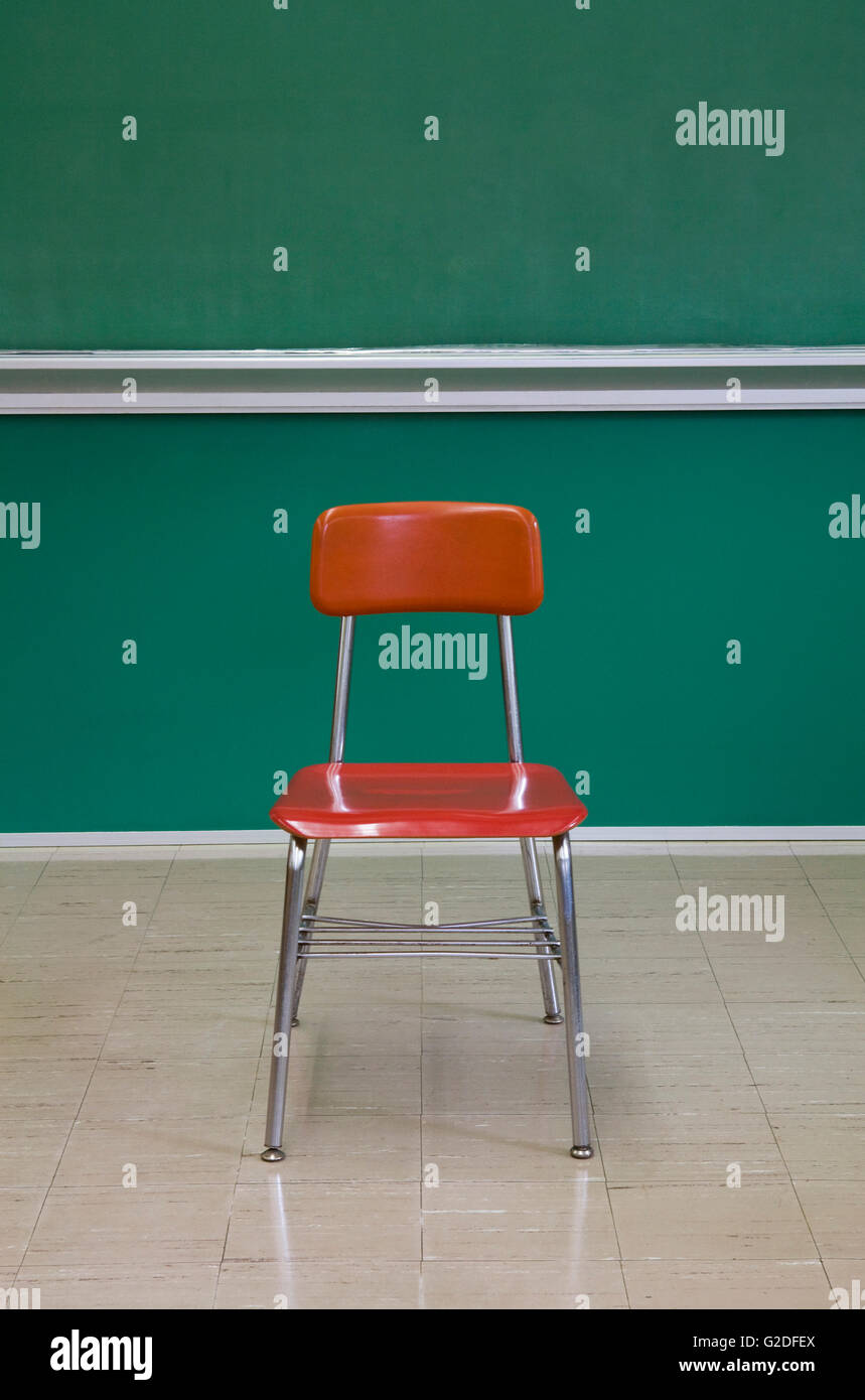Empty Red Chair by Chalkboard Stock Photo - Alamy