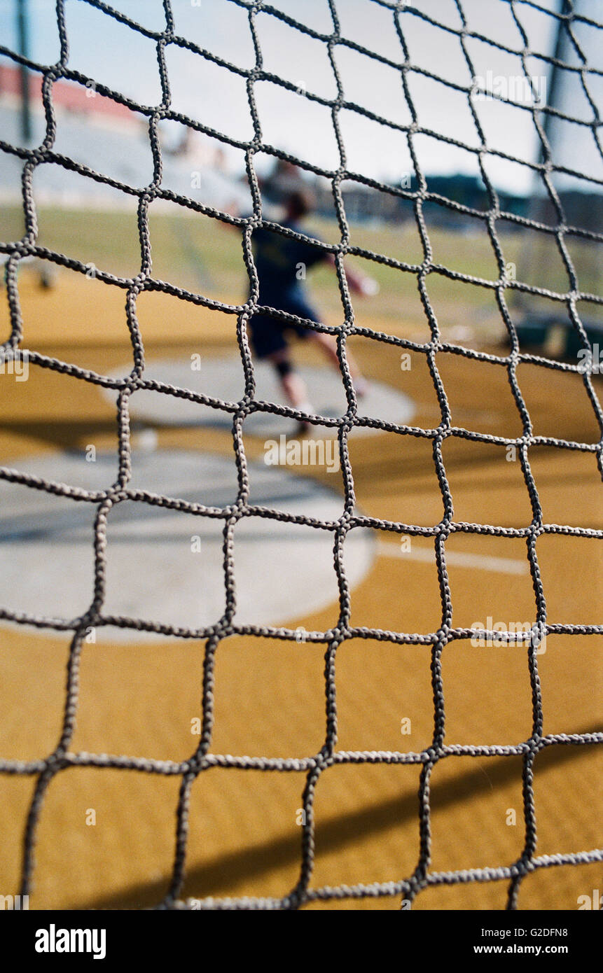 Discus Thrower Viewed Through Net Stock Photo - Alamy