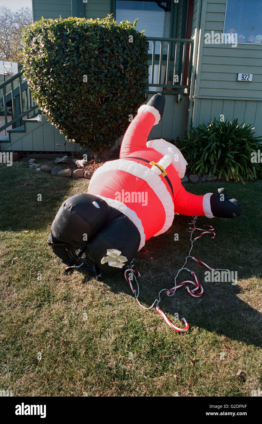 Lawn Santa Laying on Ground in Yard Stock Photo - Alamy